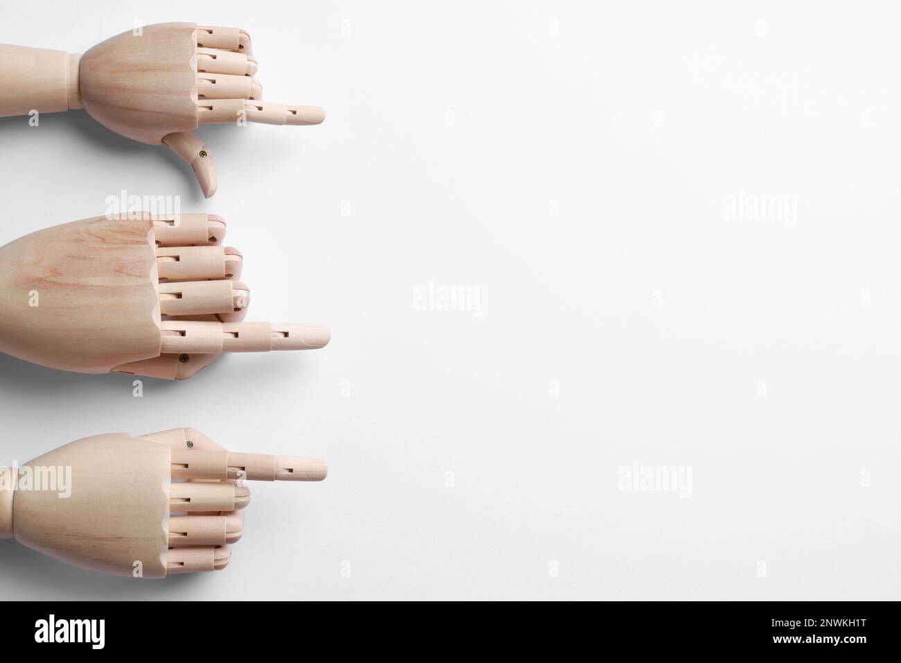 Wooden mannequin hands on white background, flat lay Stock Photo - Alamy