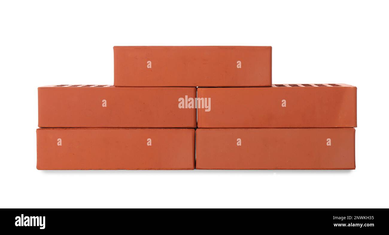Many red bricks on white background. Building material Stock Photo - Alamy
