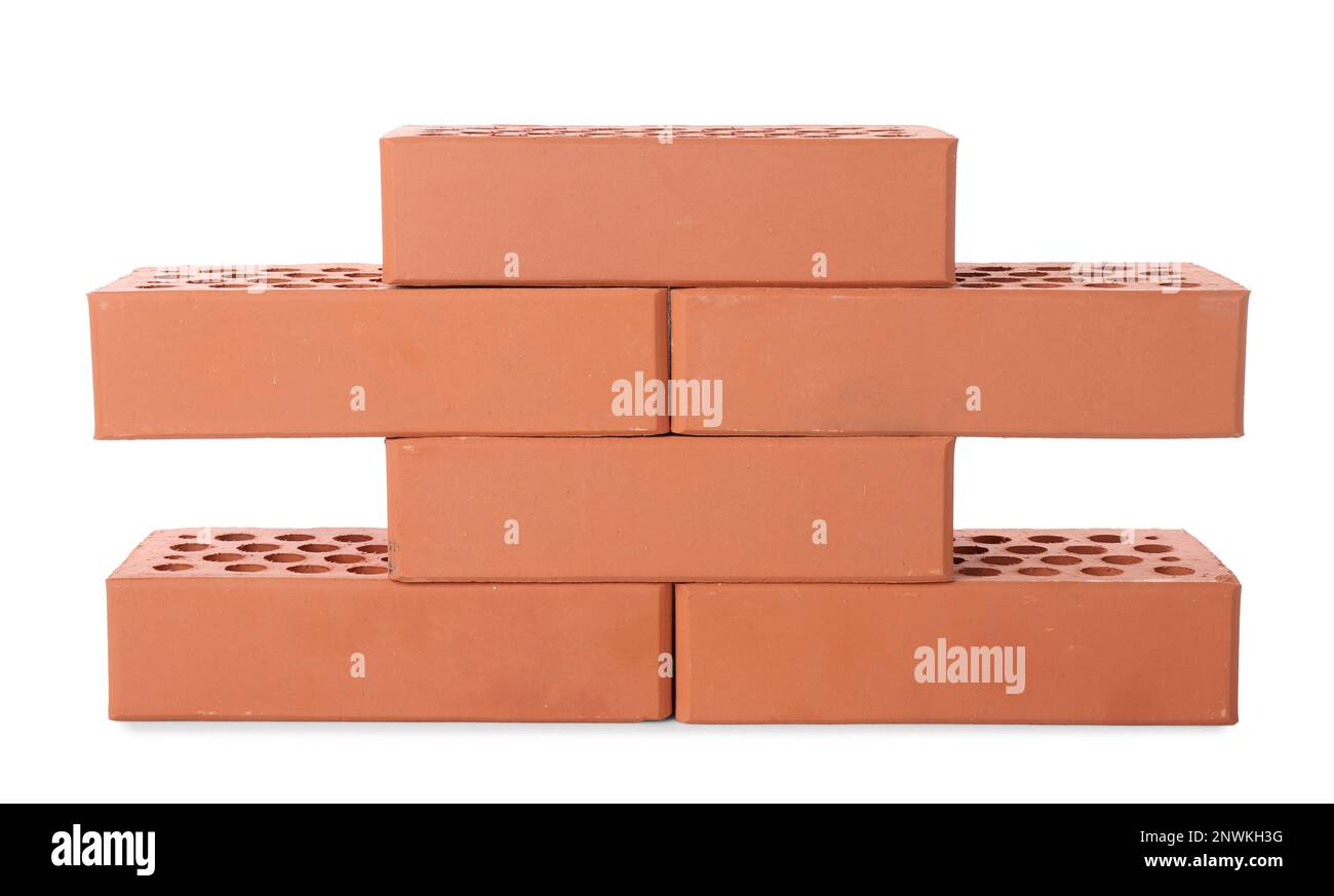 Many red bricks on white background. Building material Stock Photo - Alamy