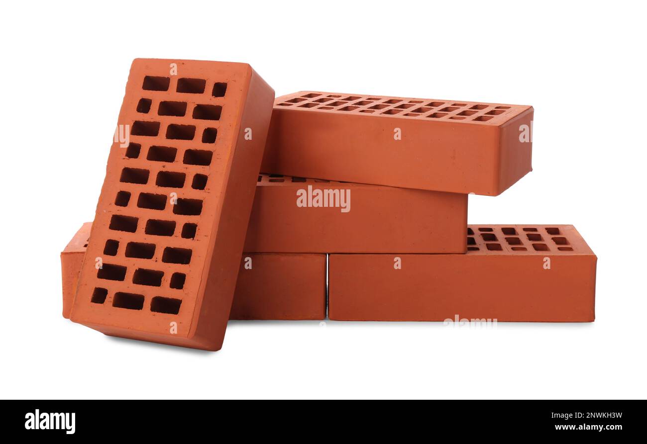 Many red bricks on white background. Building material Stock Photo - Alamy