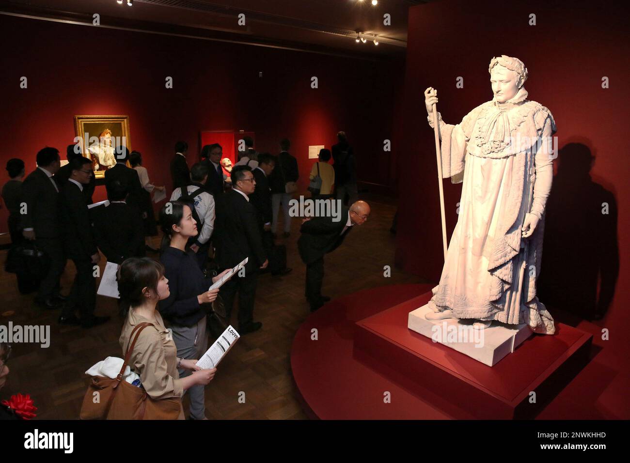 People view a sculpture The Coronation of the Emperor Napoleon I by ...