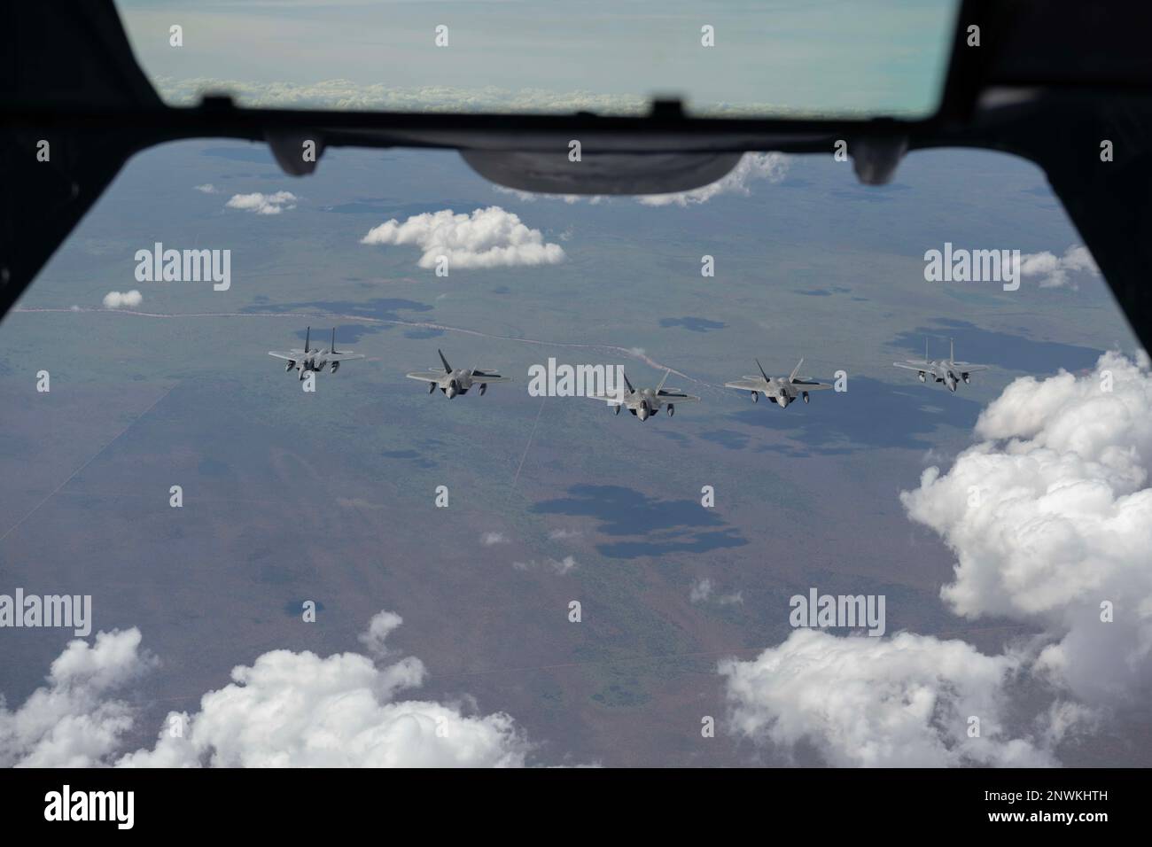 Three U.S. Air Force F-22 Raptor aircraft, middle, assigned to Joint ...