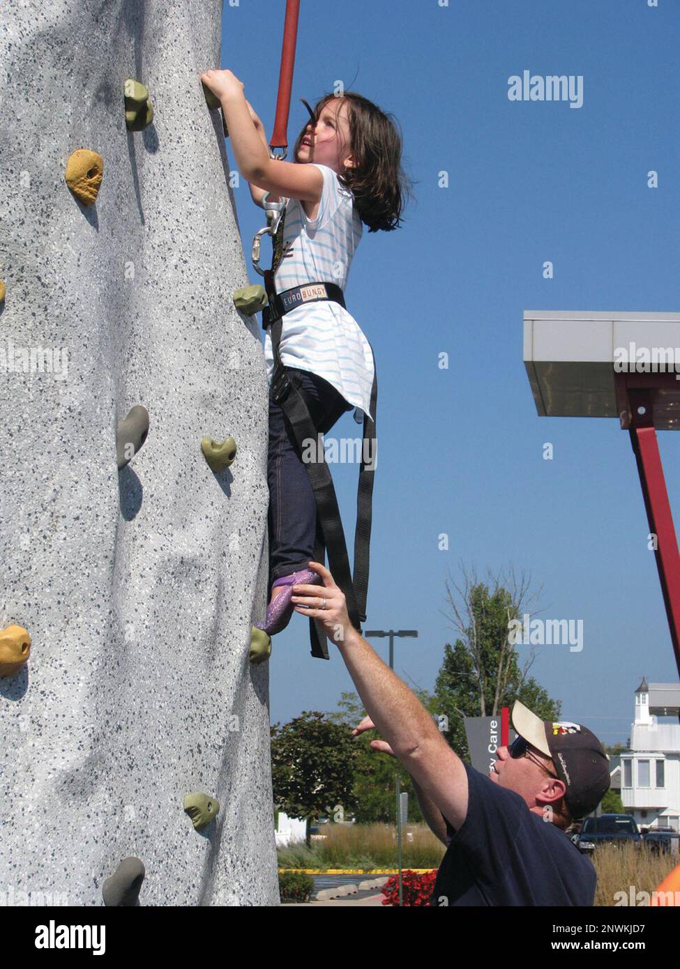 Six-year-old Chelsea Cox gets a helping hand from her father, Josh Cox ...