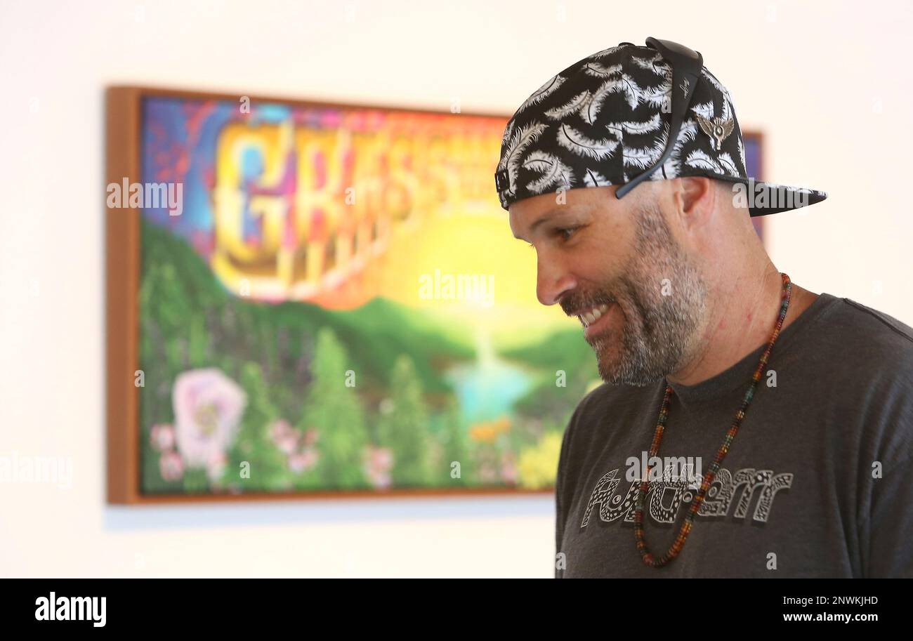 Brian Chambers stands in front of the unedited original painting of the ...