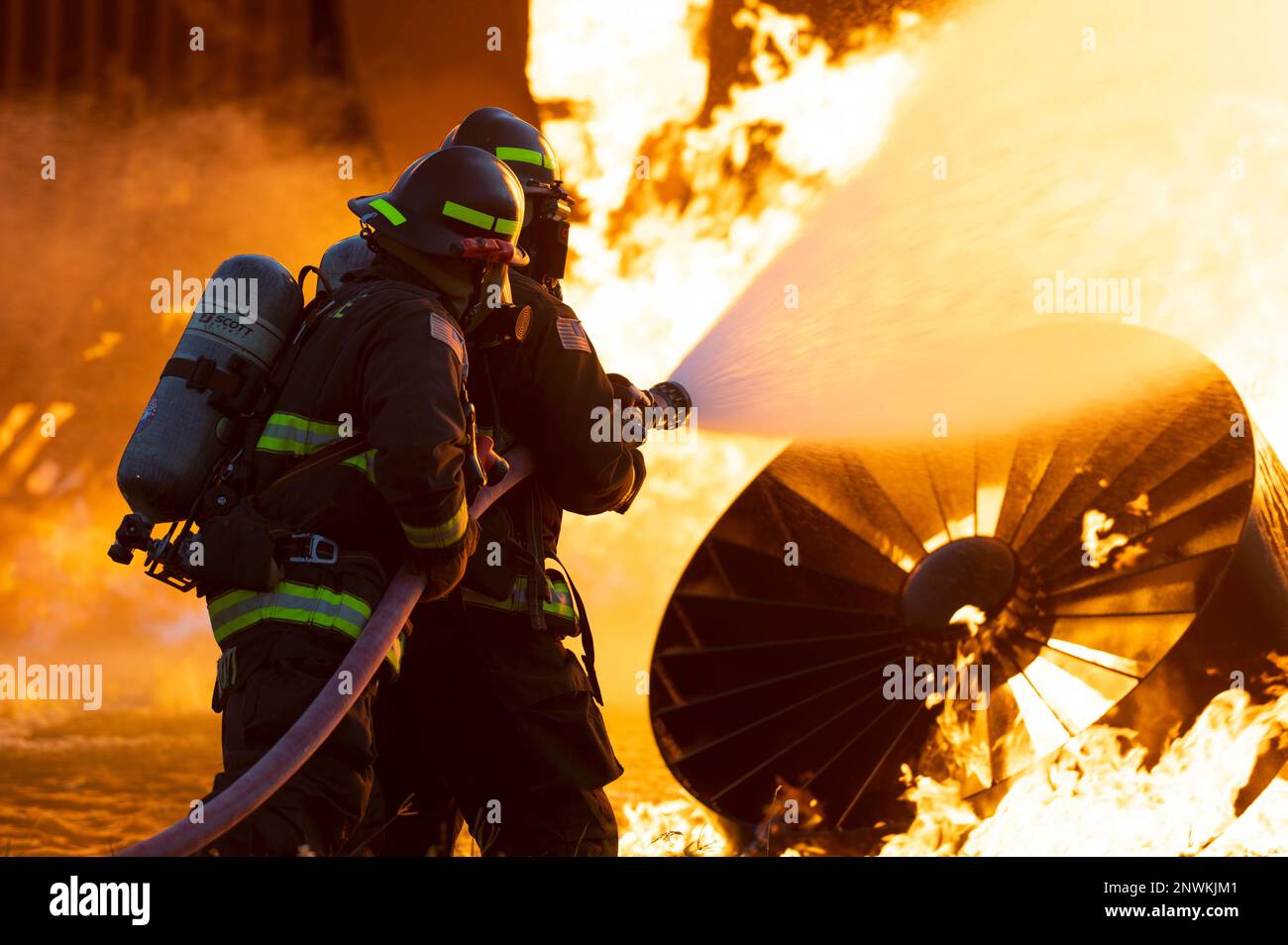 Firefighters put out a fire during fire training for Cope North on ...