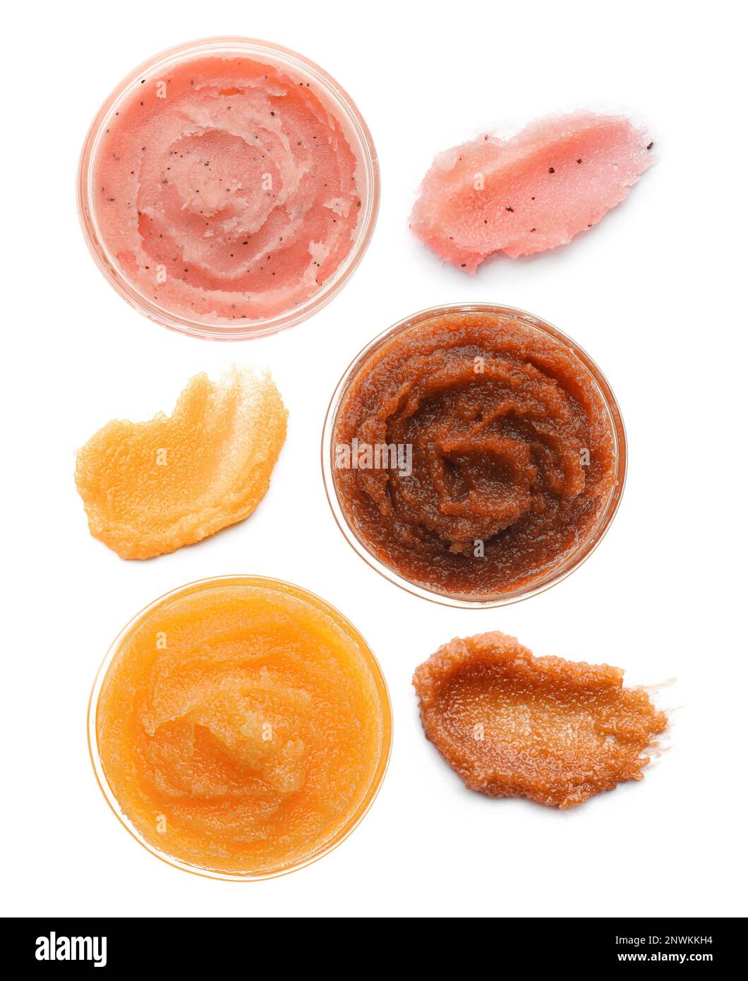 Set with different body scrubs on white background, top view Stock ...