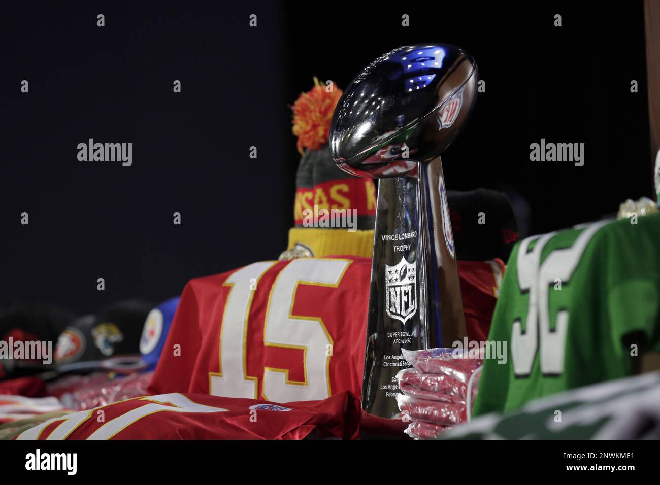 A fake Vince Lombardi Trophy stands above a table of counterfeit ...