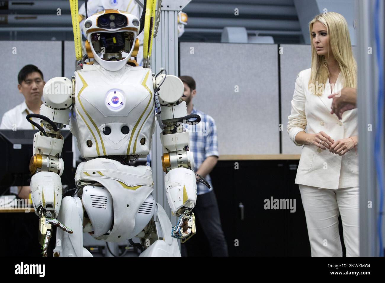 Ivanka Trump looks at a robot during a tour of the Space Vehicle Mockup ...