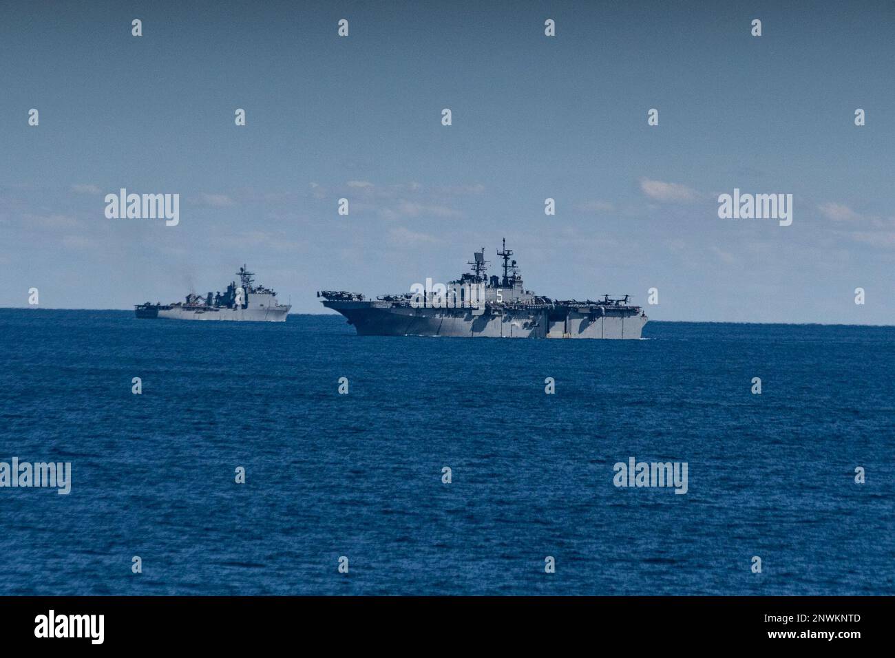 The Wasp-Class Amphibious Assault Ship USS Bataan (LHD 5) and Ferry ...