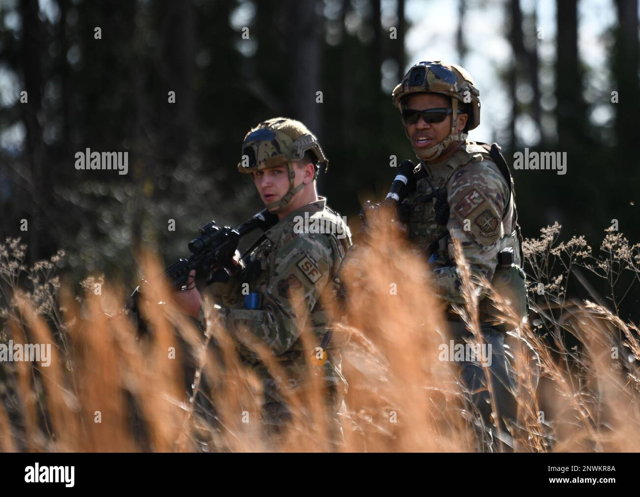 Two Airmen assigned to the 172nd Security Forces Squadron survey a ...