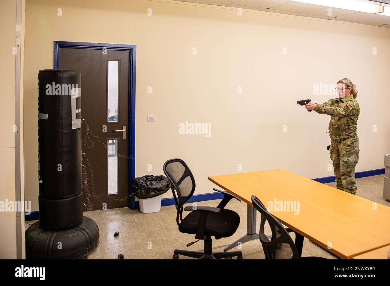 An Airman from the 423d Security Forces Squadron demonstrates firing a ...