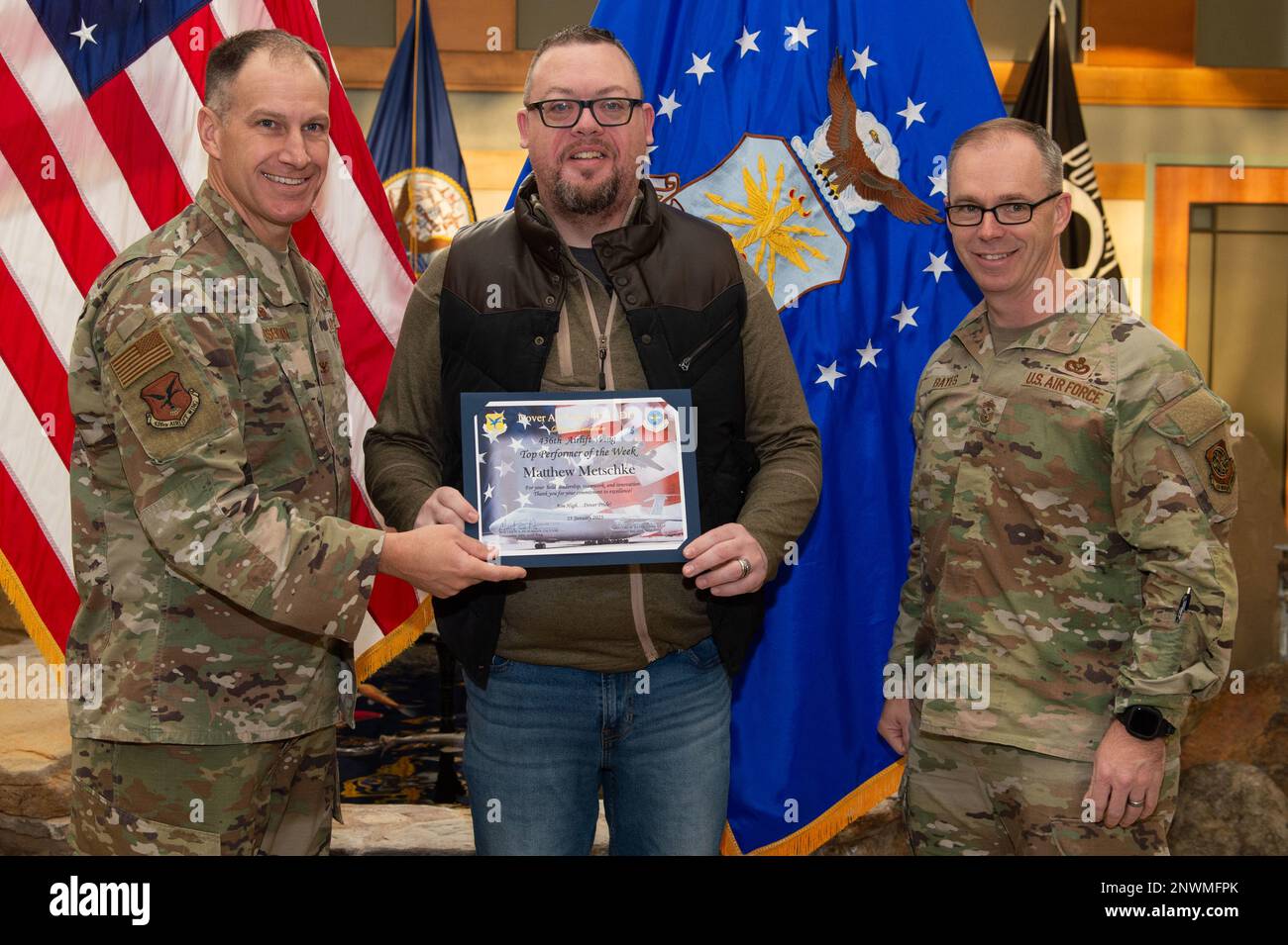 Col. Matt Husemann, left, 436th Airlift Wing commander, presents ...