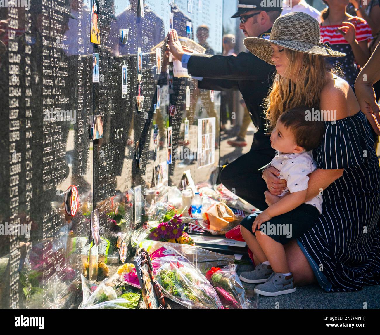 Danielle Wong spends a quiet moment as her son Colton Wong, 2, looks up ...