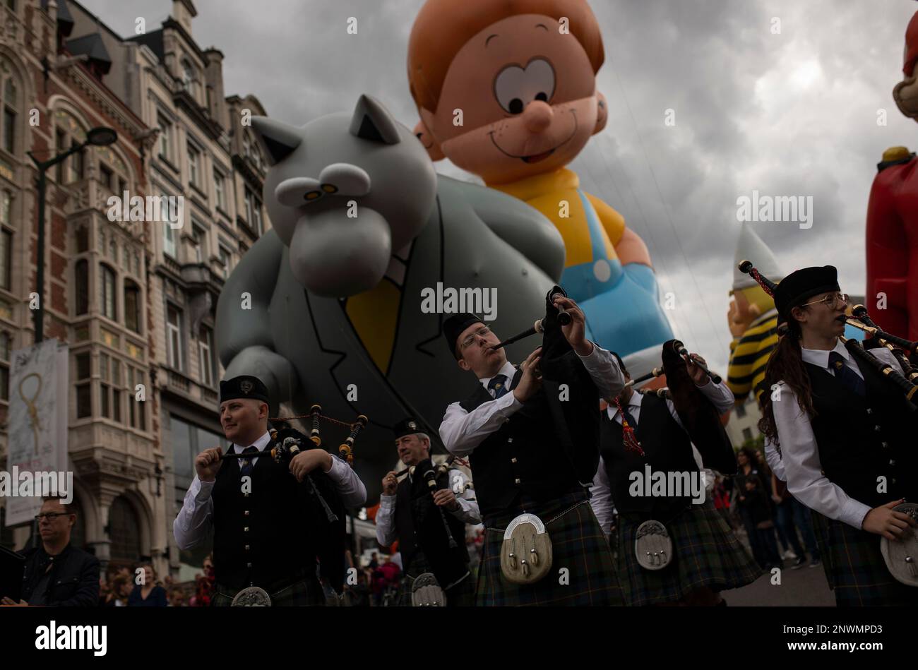 Giant inflated balloons with shapes of comic strip characters fly ...