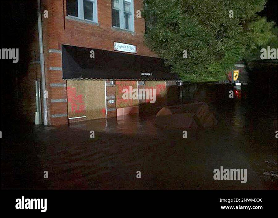 In this photo released by the New Bern Police department, flood waters ...