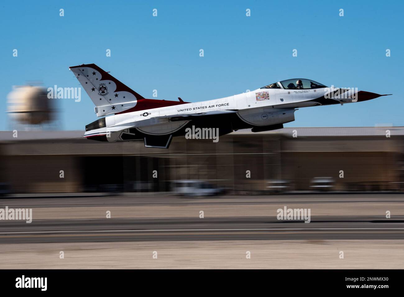 An F-16 Fighting Falcon fighter jets assigned to the Thunderbirds takes ...