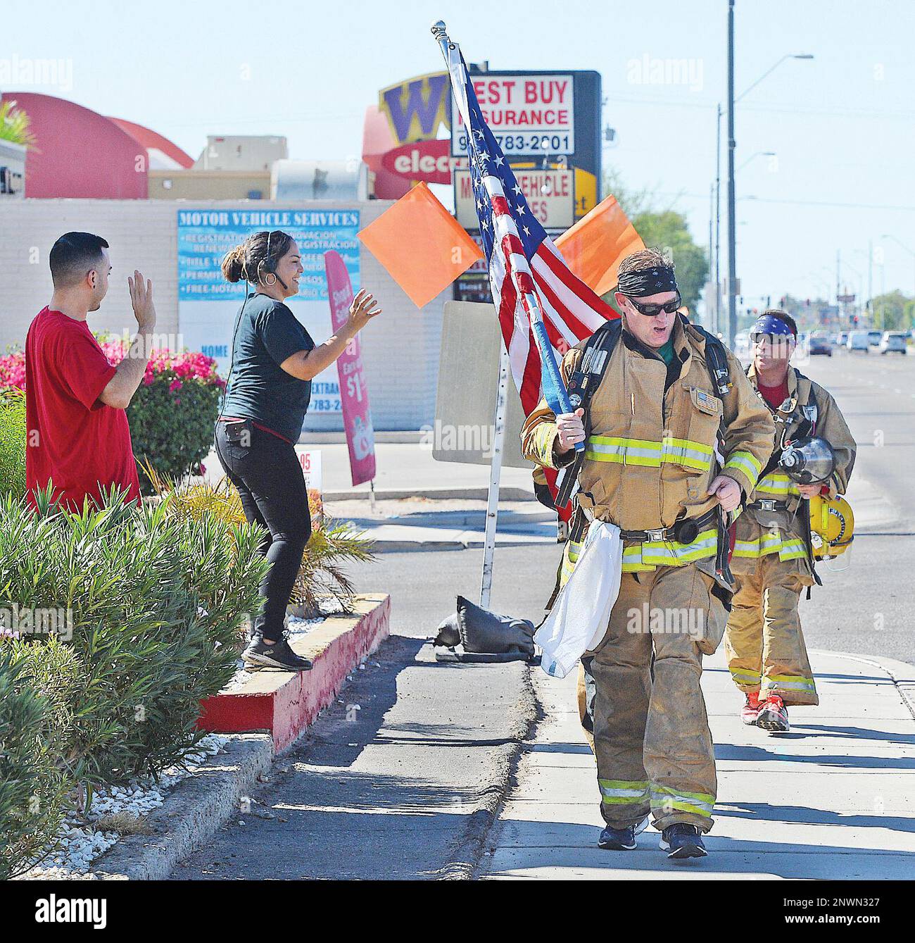 Employees at Wienerschnitzel, left, 1775 S. 4th Ave, come out to cheer ...