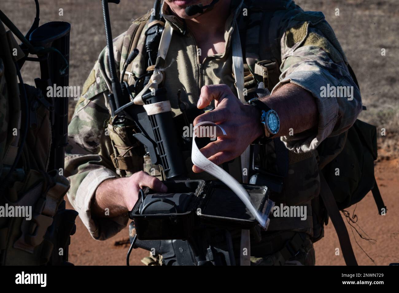 A Special Tactics operator hands over a Dynamic Cone Penetrometer test ...