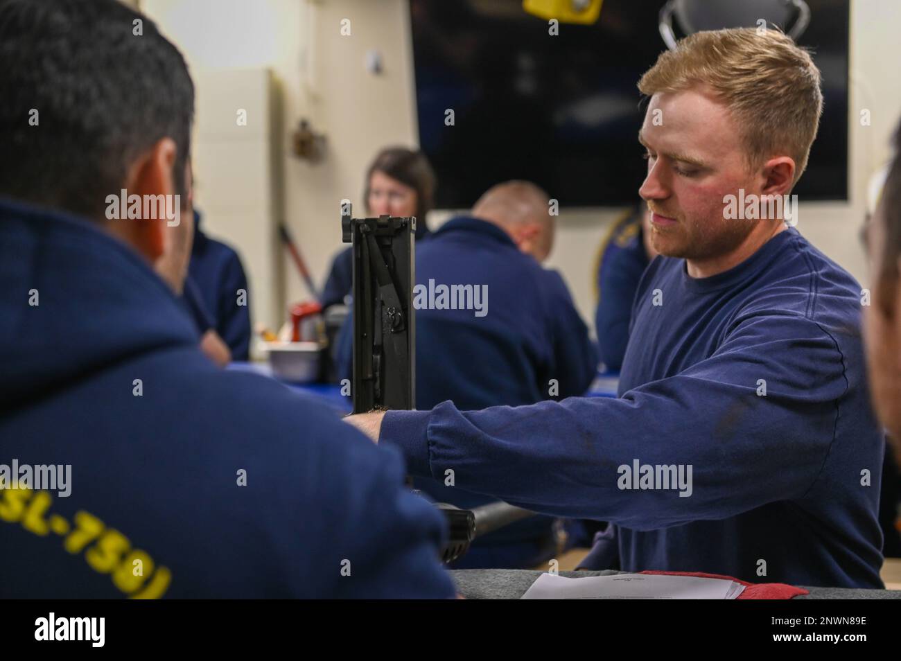 U.S. Coast Guard Petty Officer 2nd Class Jeremiah Johnson, a gunner’s ...