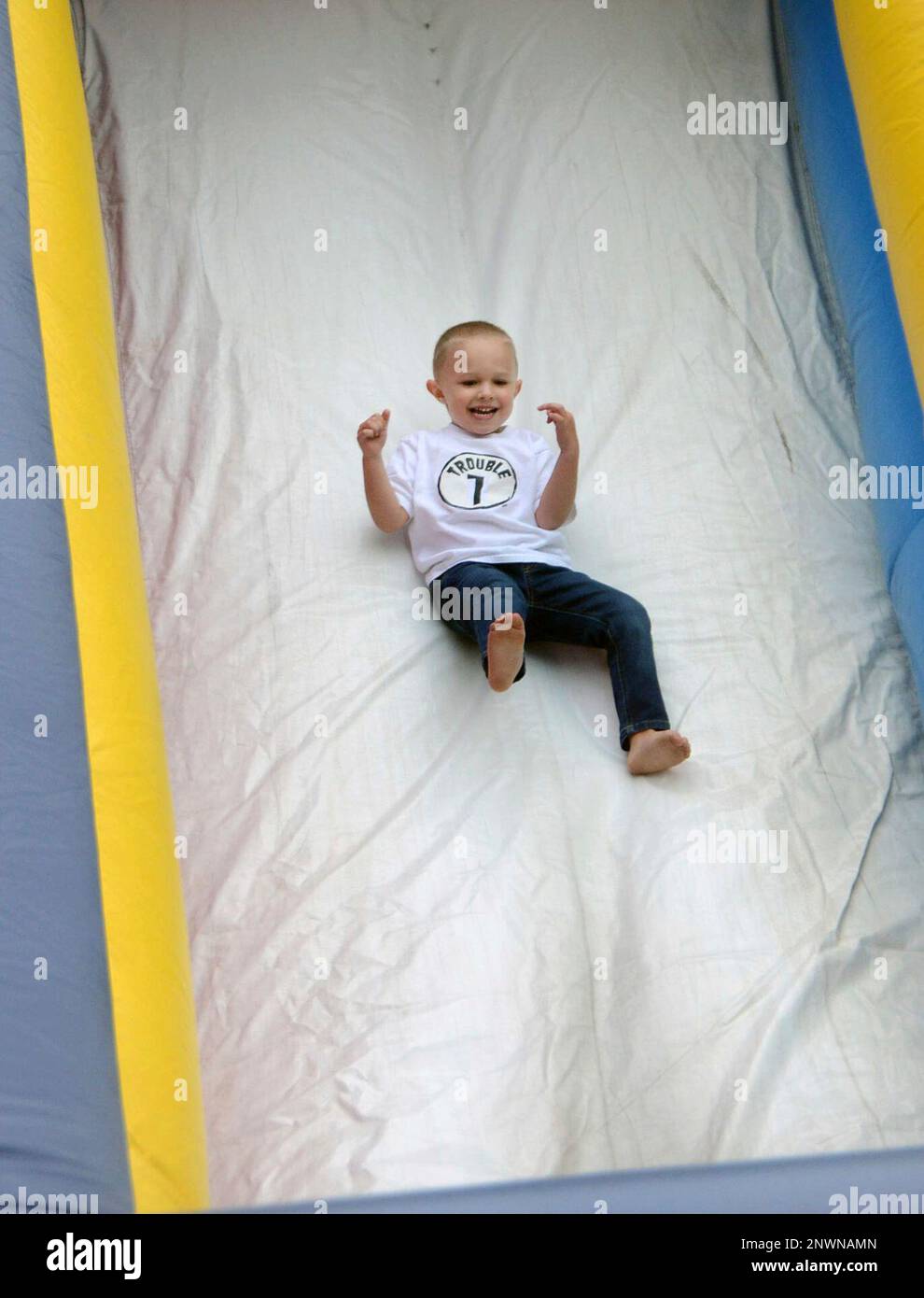 Four-year-old Vinny Kasarda is all smiles as he comes down a giant ...