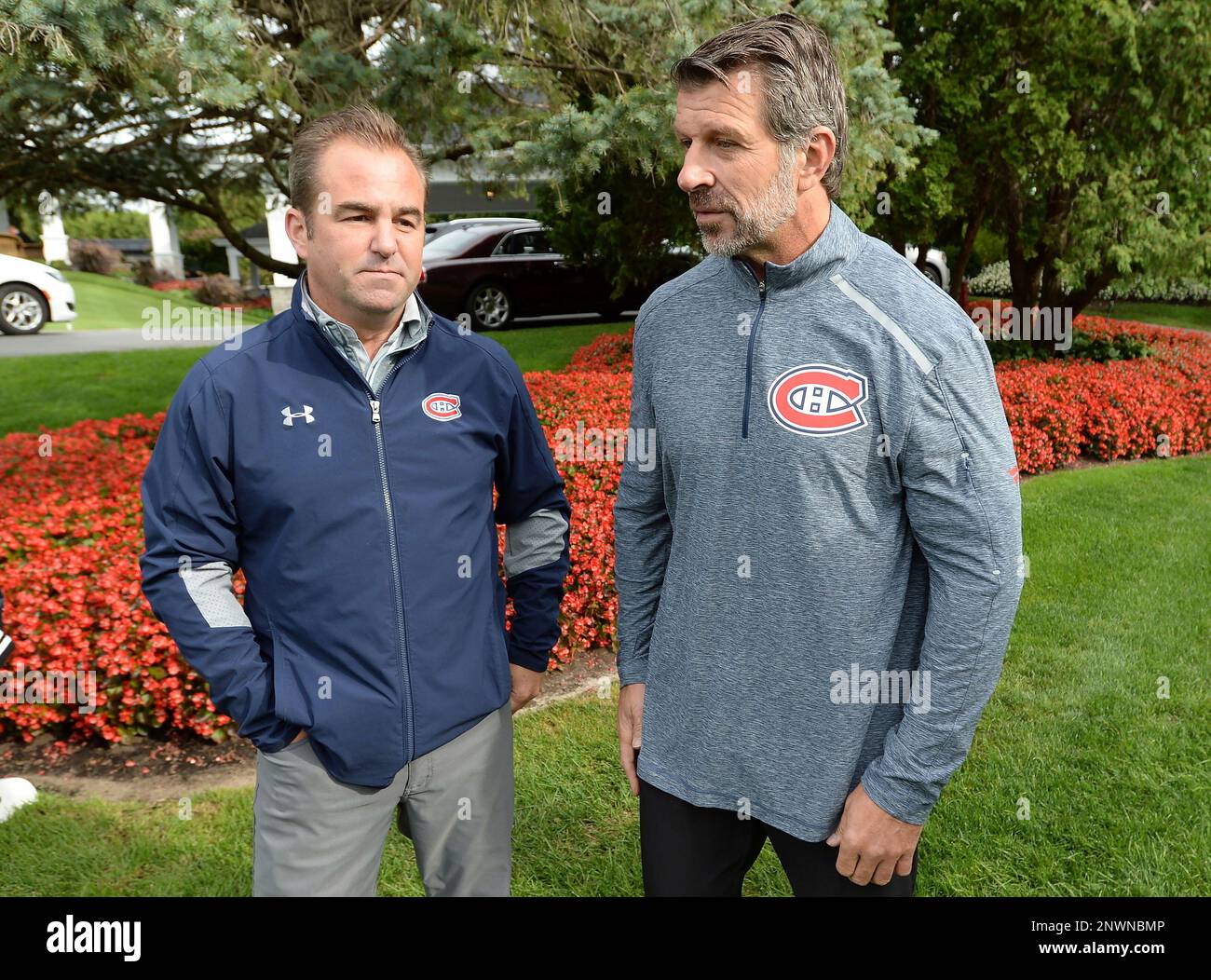 Montreal Canadiens owner Geoff Molson, left, speaks with general ...