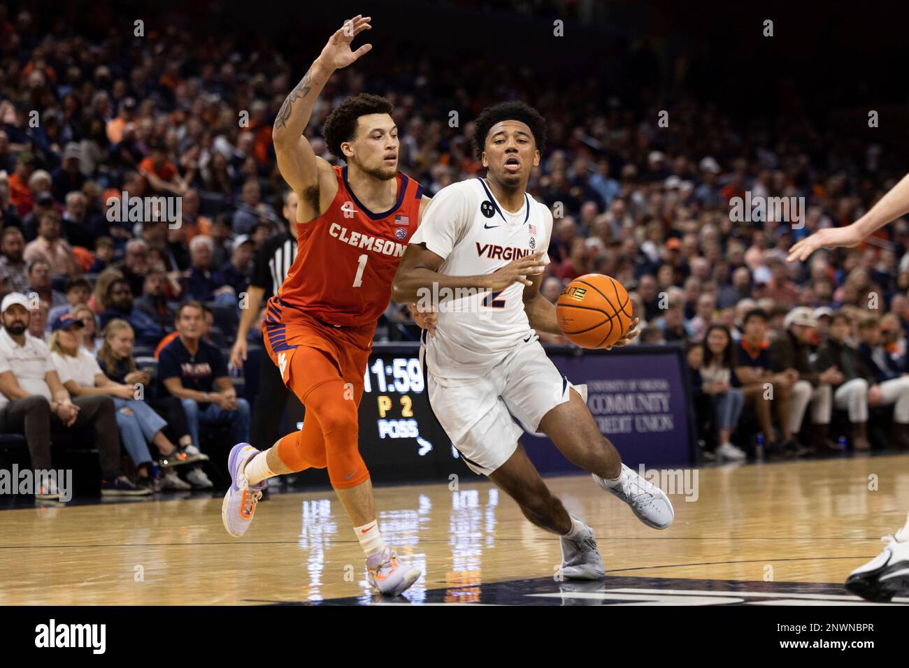 Virginia's Reece Beekman (2) defends the ball from Clemson's Chase ...