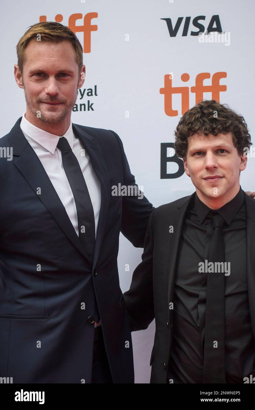 Actors Alexander Skarsgard, left, and Jesse Eisenberg poses for photos ...