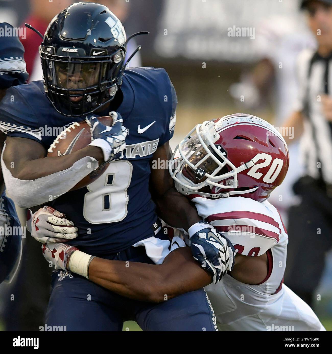 Utah State running back Gerold Bright (8) carries the ball as New ...