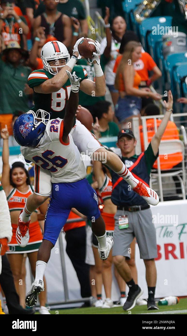Miami tight end Will Mallory scores a touchdown against Savannah State defensive back Darrell ...