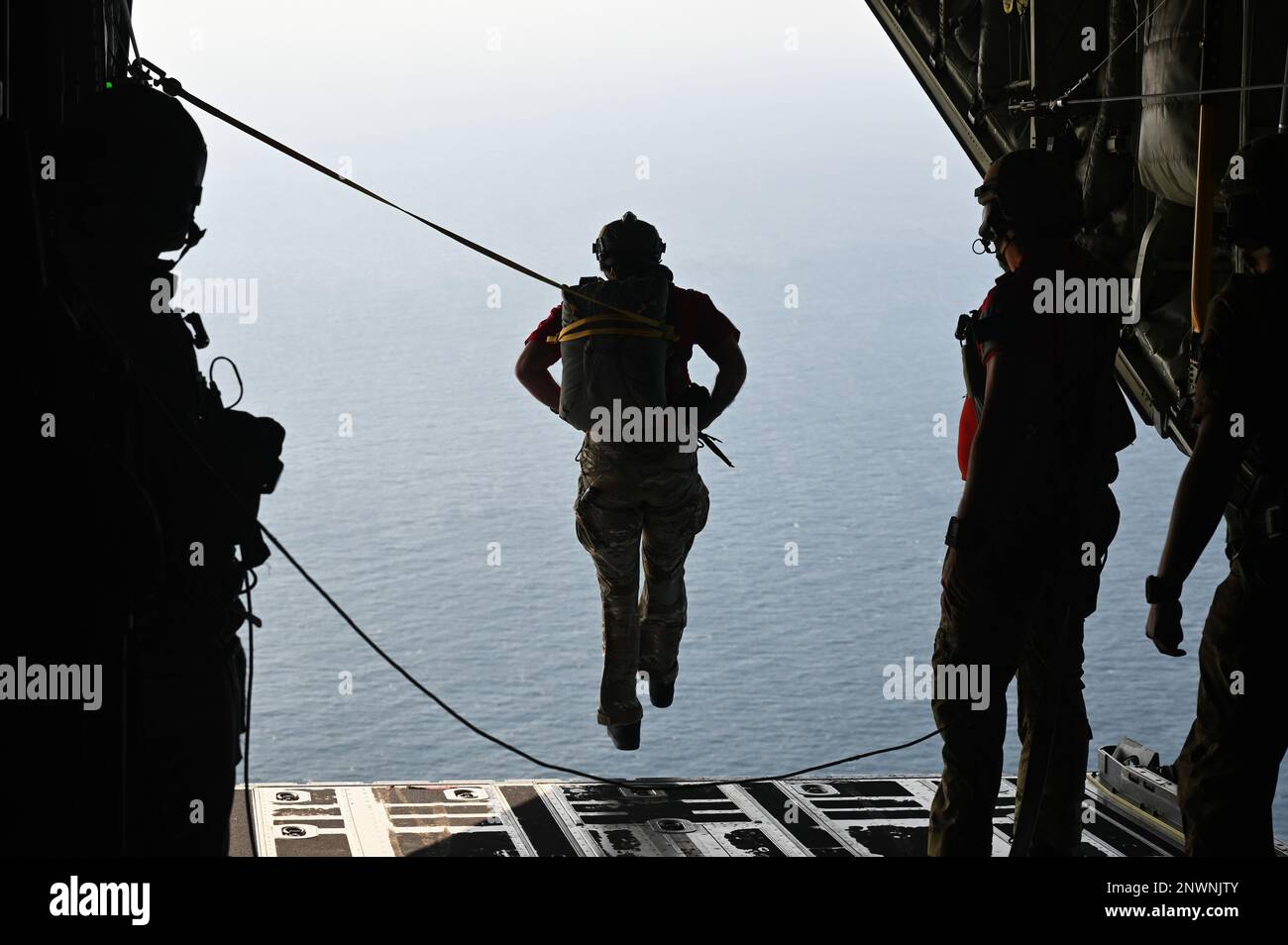 A U.S. Air Force Pararescueman jumps from an HC-130J Combat King II ...