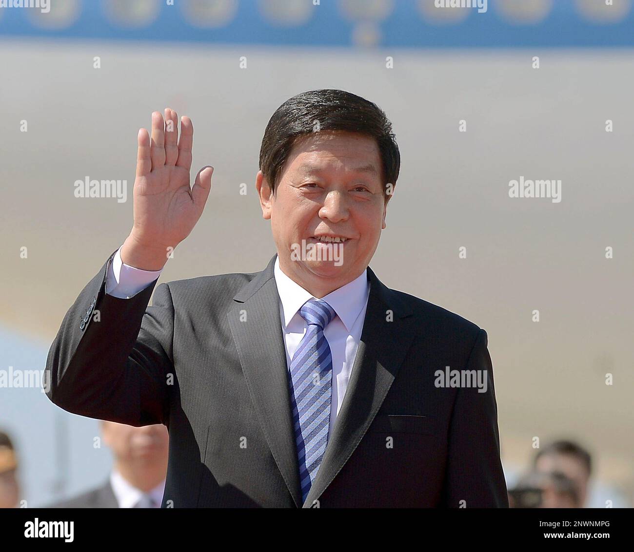 Senior Chinese official Li Zhanshu waves upon arrival at Pyongyang ...