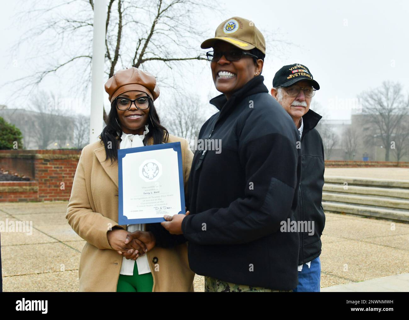 230131-N-ZV473-1006 NORFOLK, VA (Jan. 31, 2023) Four civilian employees ...