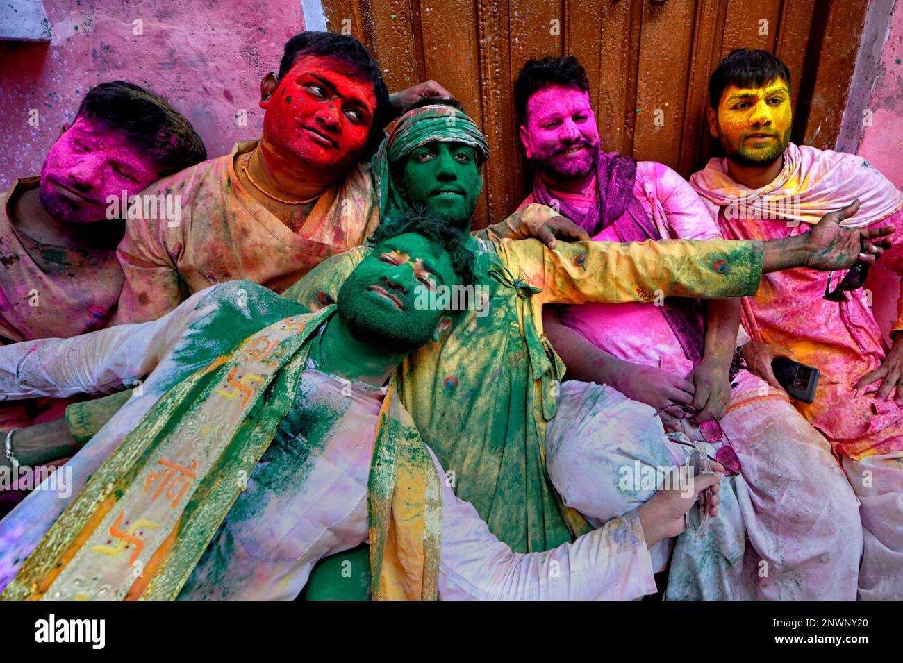 Mathura, India, 28/02/2023, Devotees with colour all over, pose for a ...