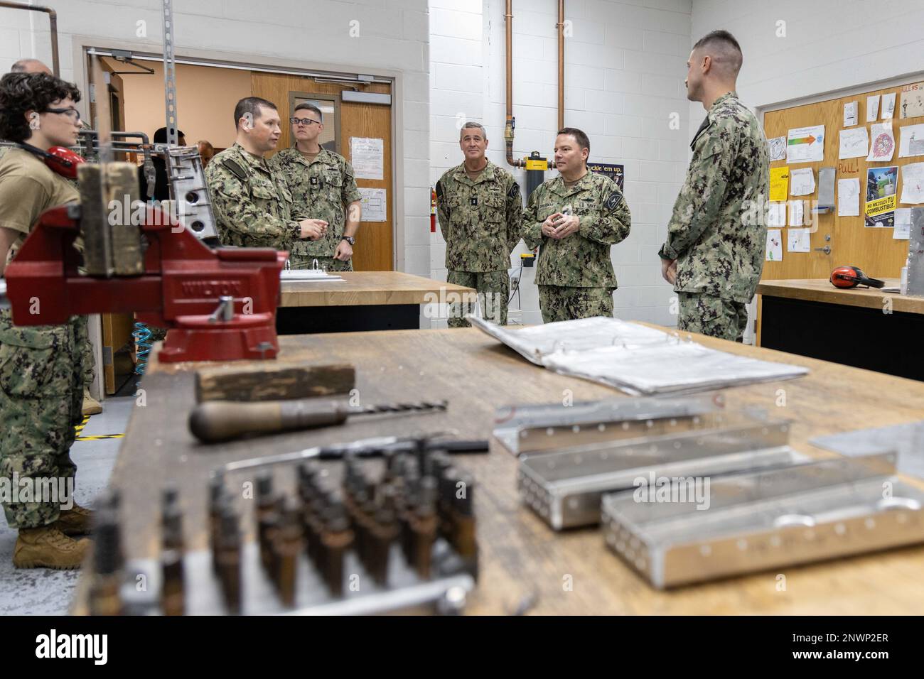 Chief of Naval Personnel Vice Adm. Rick Cheeseman, center, is given a ...