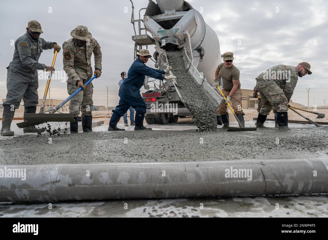 379th Expeditionary Civil Engineer Squadron Airmen lay concrete at the ...
