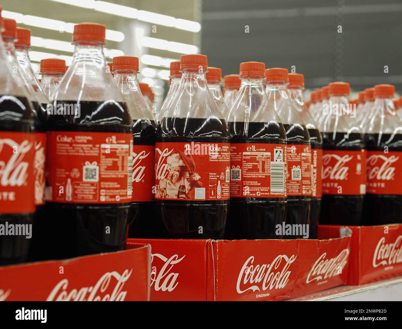 Passau, Germany. 28th Feb, 2023. Row of coca-cola bottles on a shelf in ...