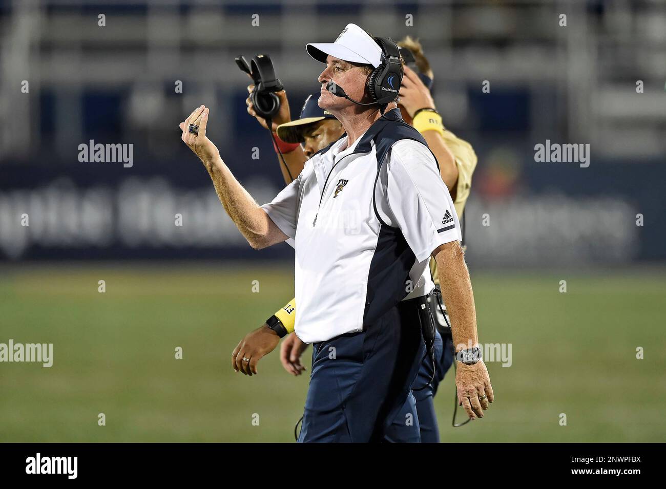 MIAMI, FL - SEPTEMBER 1: FIU Football Head Coach Butch Davis signals to ...