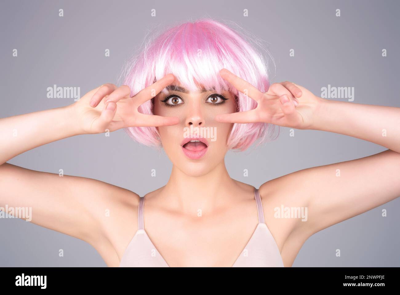 Close up photo of impressed woman isolated over studio background ...