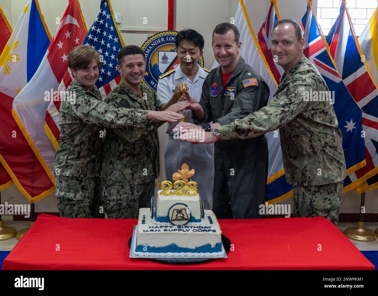 230221-N-ZZ999-0042 SINGAPORE (Feb. 21, 2023) From left: Rear Adm ...