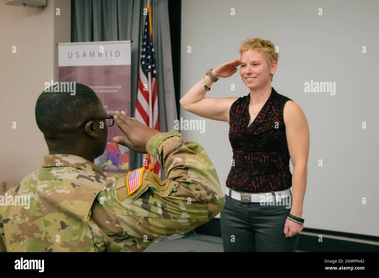 Captain Sara Johnston, U.S. Army Reserve, exchanges a salute with her ...