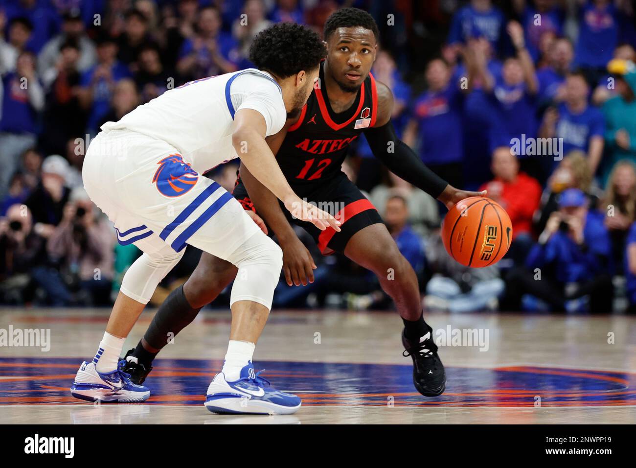 San Diego State's Darrion Trammell (12) looks for a pass around Boise ...