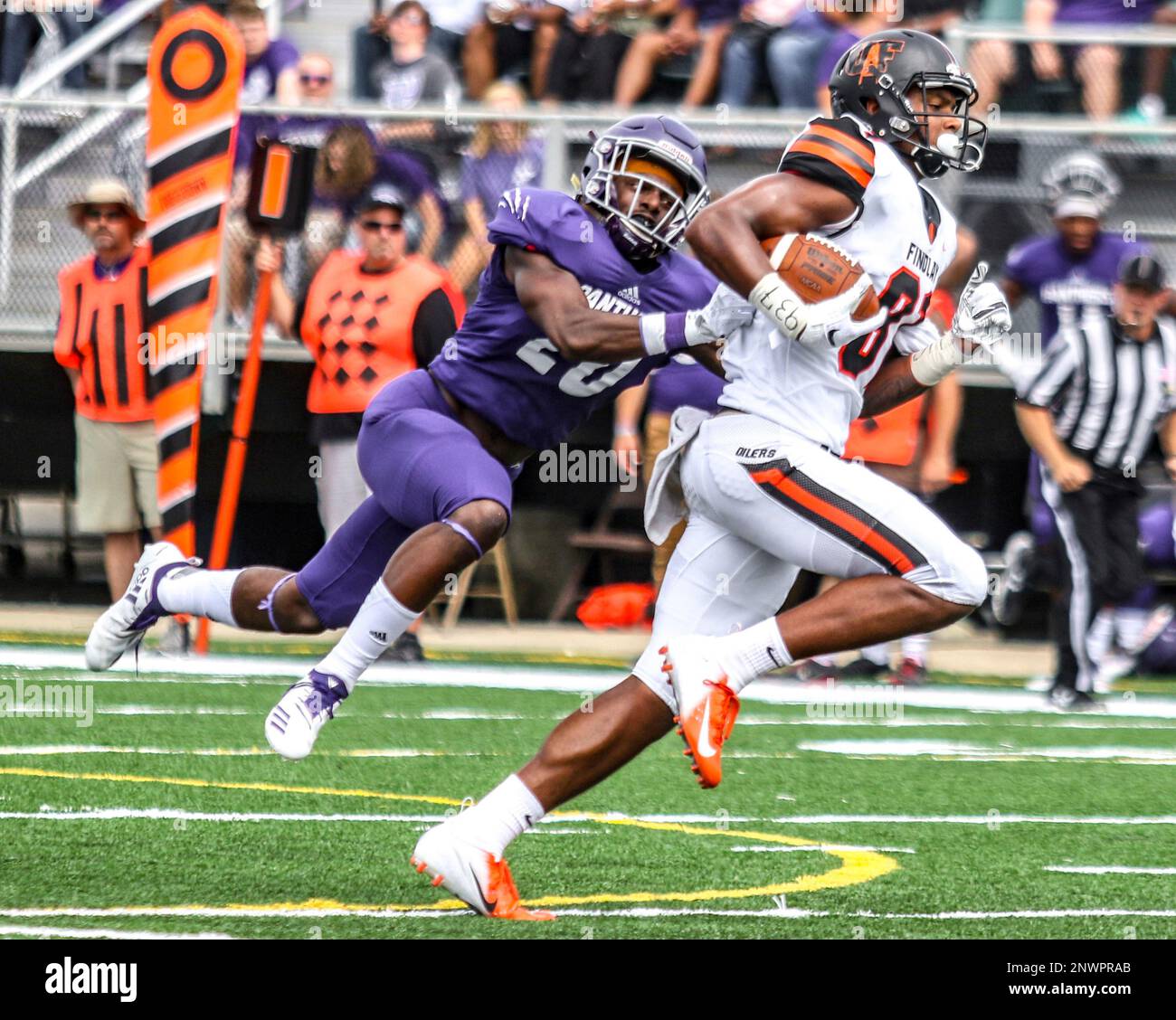 Kentucky Wesleyan's Shedrick, left, Kirk puts a tackle on Flindlay's ...