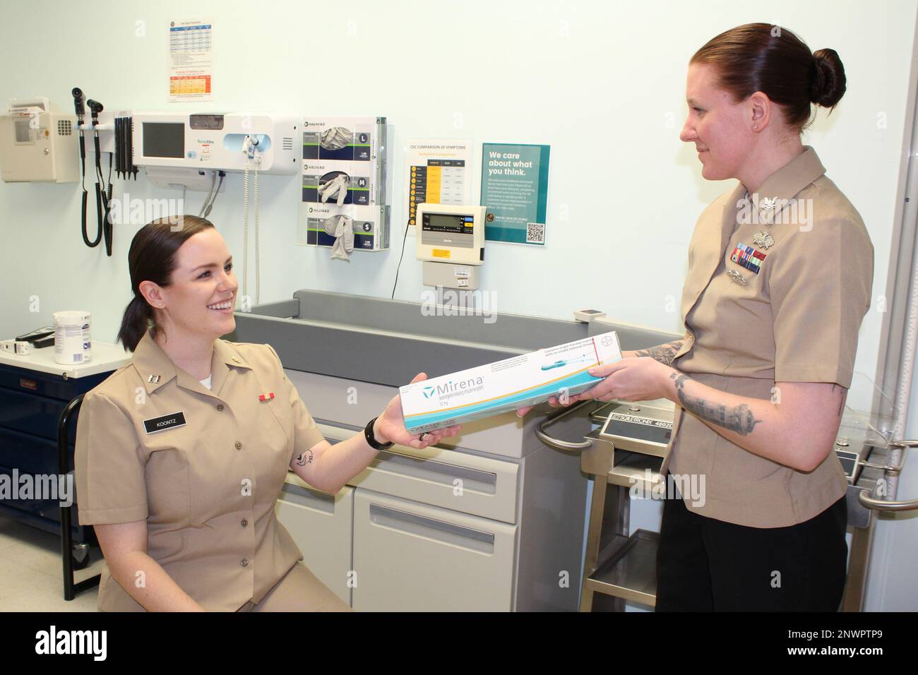 Hospital Corpsman 2nd Class Victoria McPhall hands Lt. Laken Koontz an ...