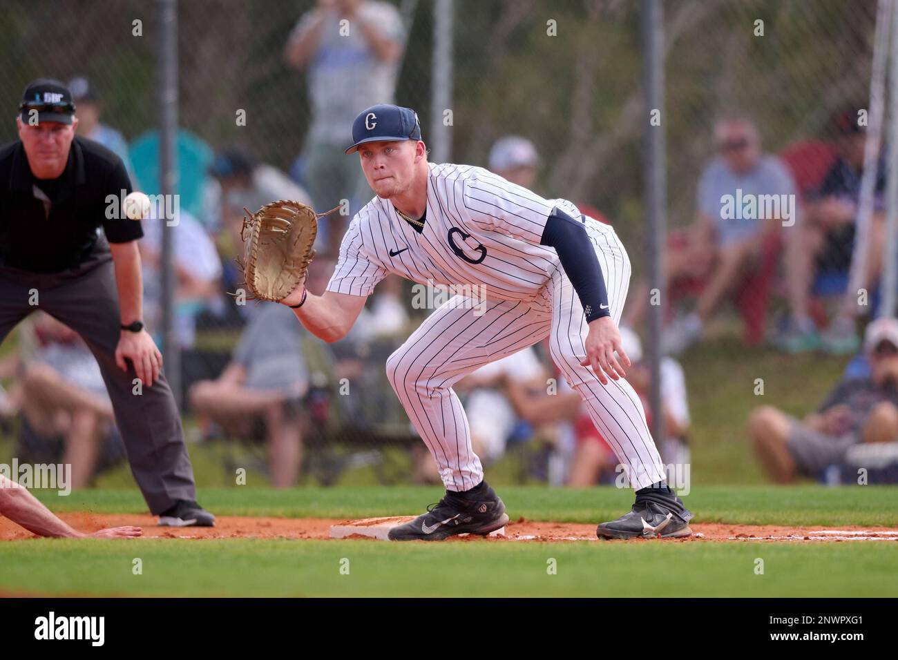 UConn Huskies first baseman Ben Huber (44) catches a pickoff attempt ...