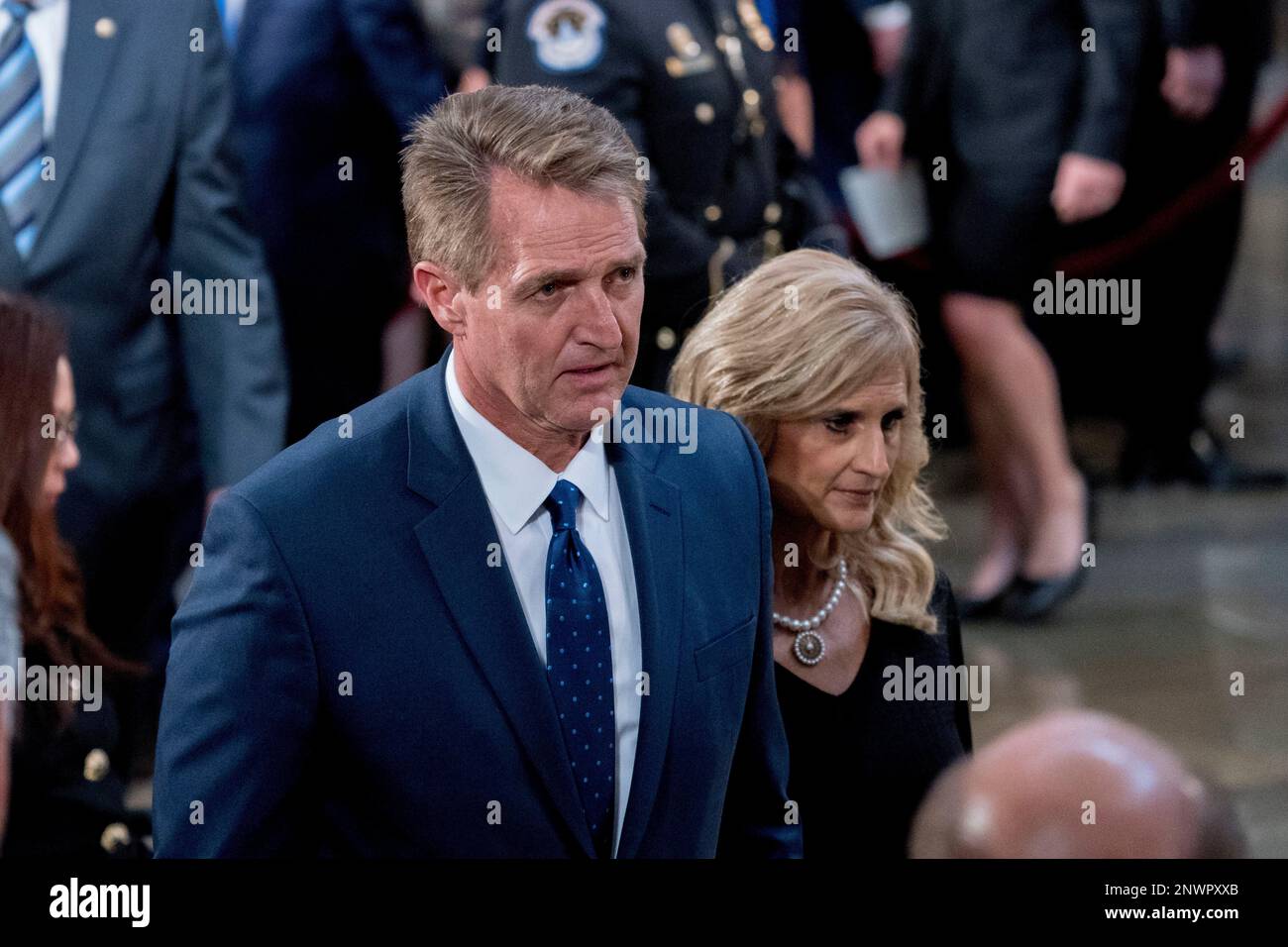 Sen. Jeff Flake, R-Ariz., and his wife Cheryl Flake depart a ceremony ...