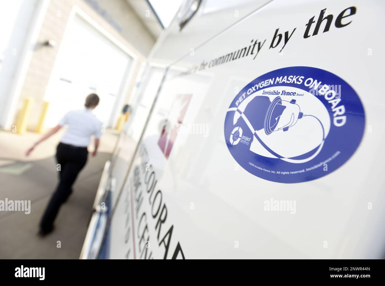 Paramedic, Natalie Perry, walks by the sticker shows the ambulance is ...