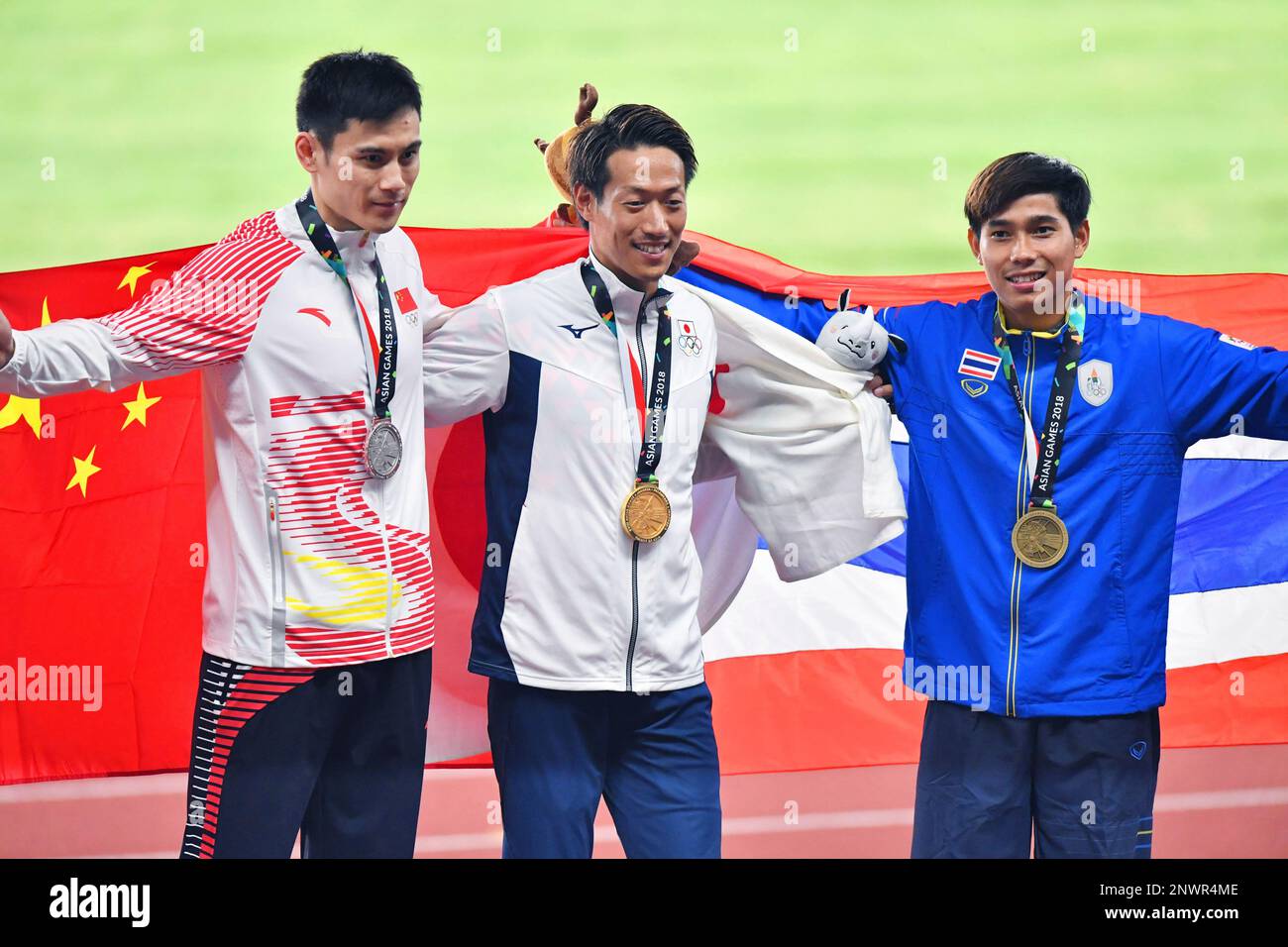 (L-R) China's Jie Yao, silver, Japan's Seito Yamamoto, gold and ...