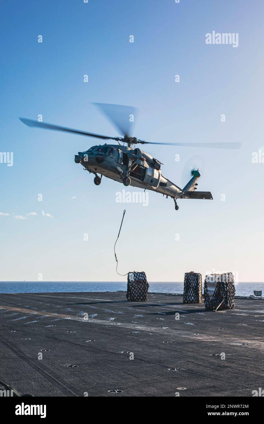 230122-UI066-1118 IONIAN SEA (Jan. 22, 2023) An MH-60S Nighthawk ...