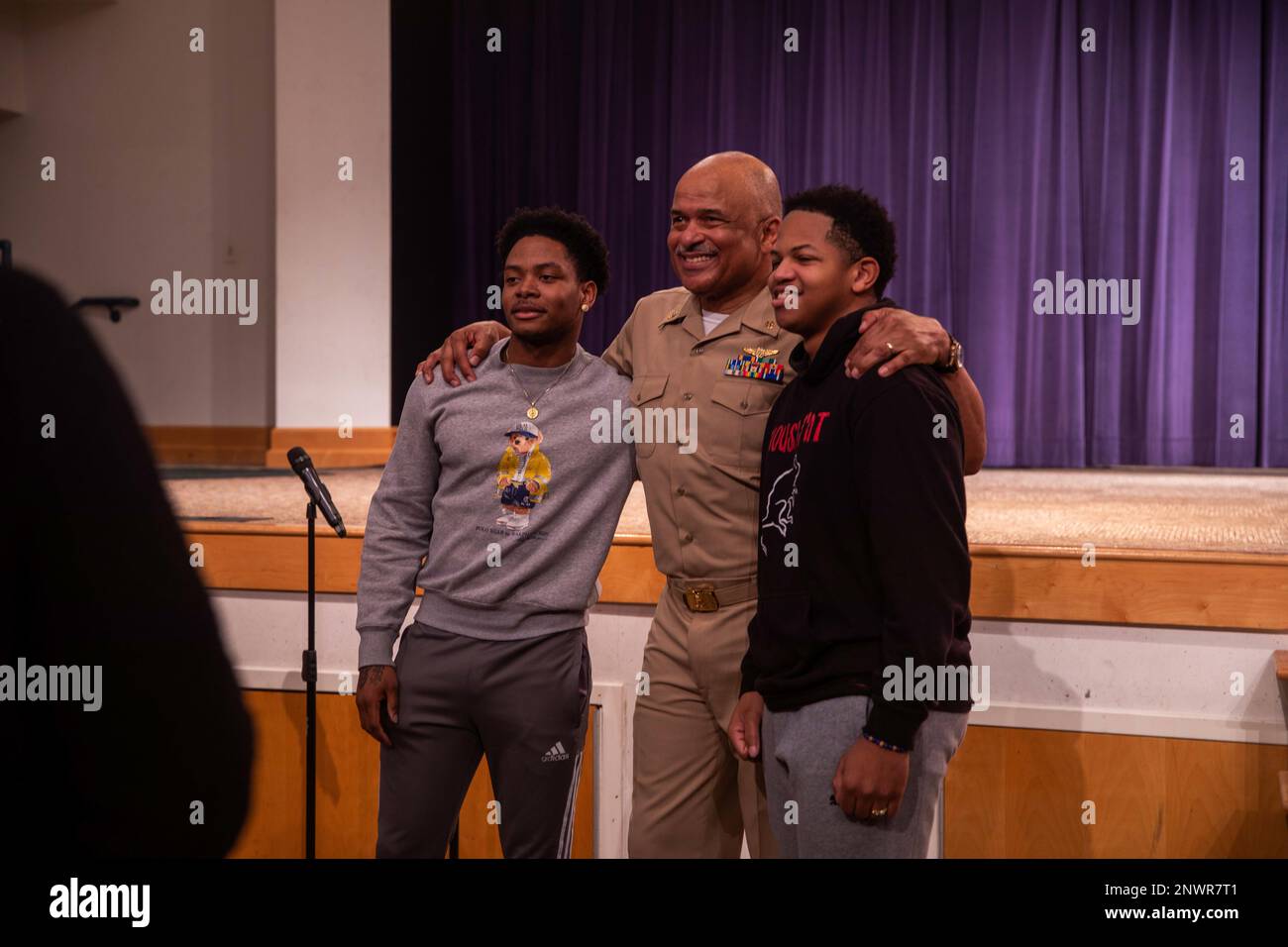 Retired U.S. Army Chief Warrant Officer 5 Phillip Brashear takes pictures with the crew of the ...
