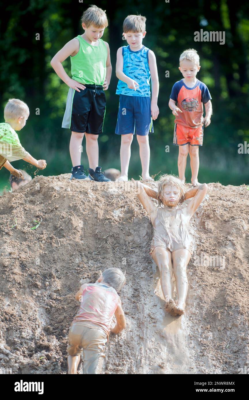 Kids play in mud Saturday, August 25, 2018, in the Mud Happens mud run ...